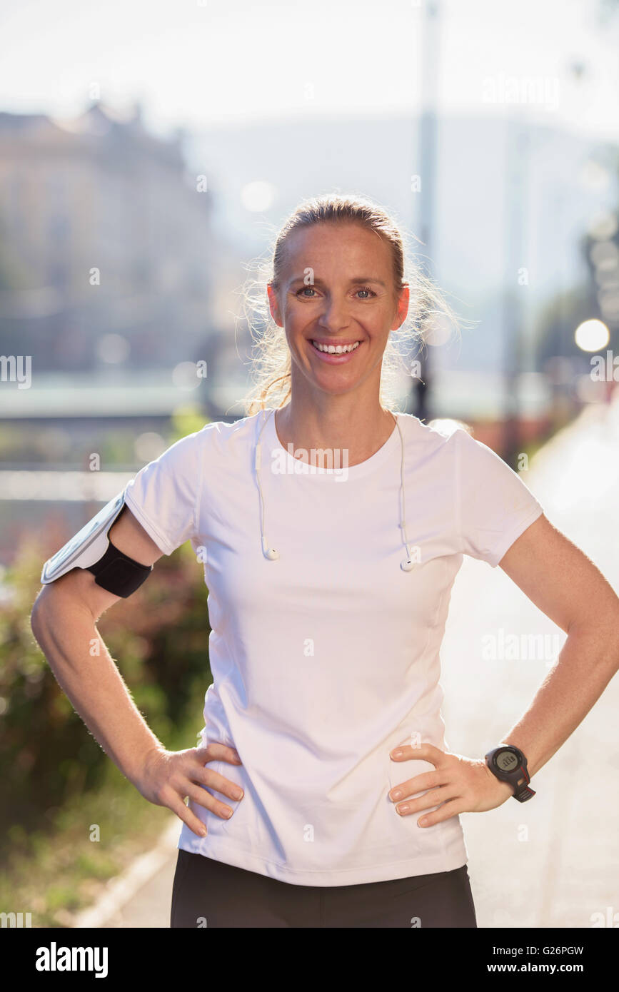 portrait of jogging woman before running on early morning with sunrise ...