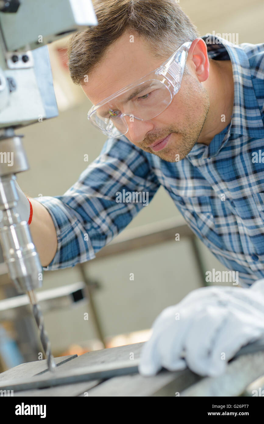 Man drilling hole factory hi-res stock photography and images - Alamy