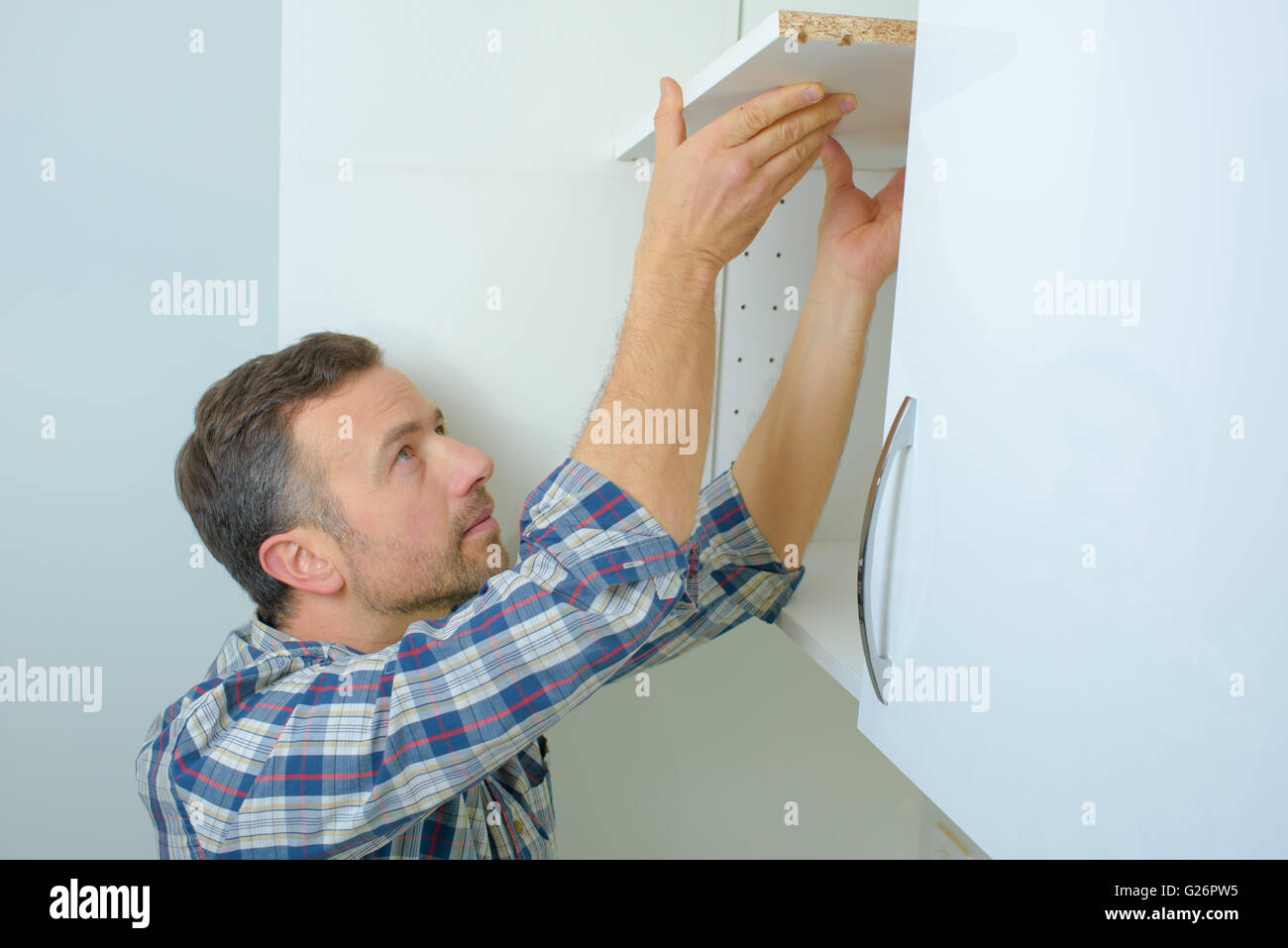 Man fitting kitchen sink hi-res stock photography and images - Alamy