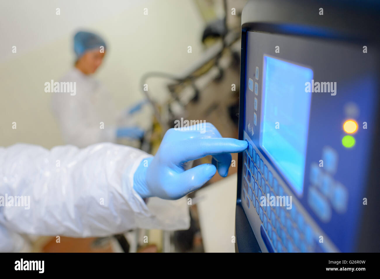 Factory operative using computer Stock Photo - Alamy