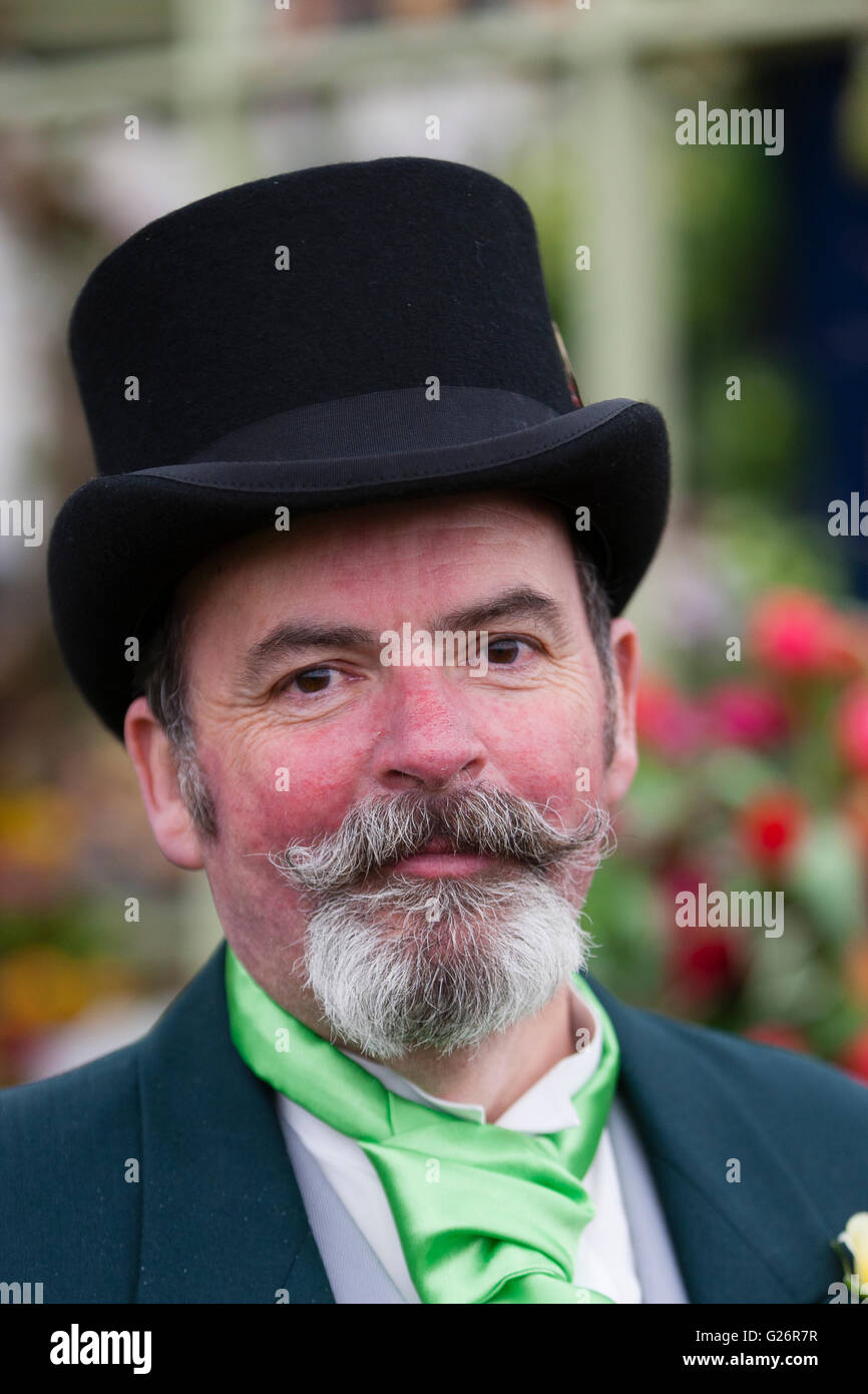 Chelsea Flower Show, London, UK. Adrian Cooke wearing a top hat and a ...