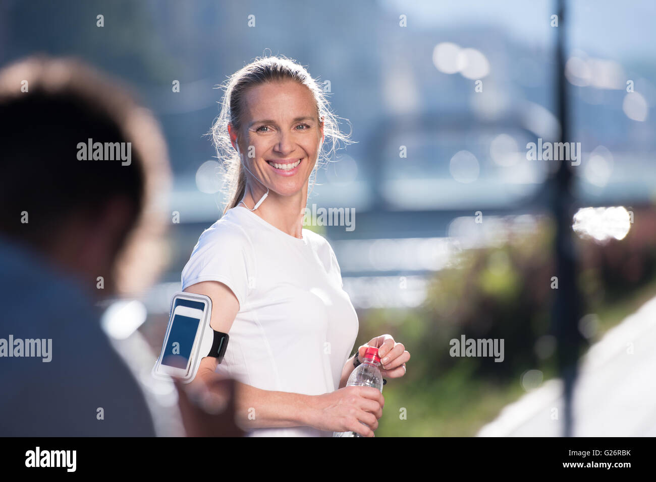 portrait of jogging woman before running on early morning with sunrise ...