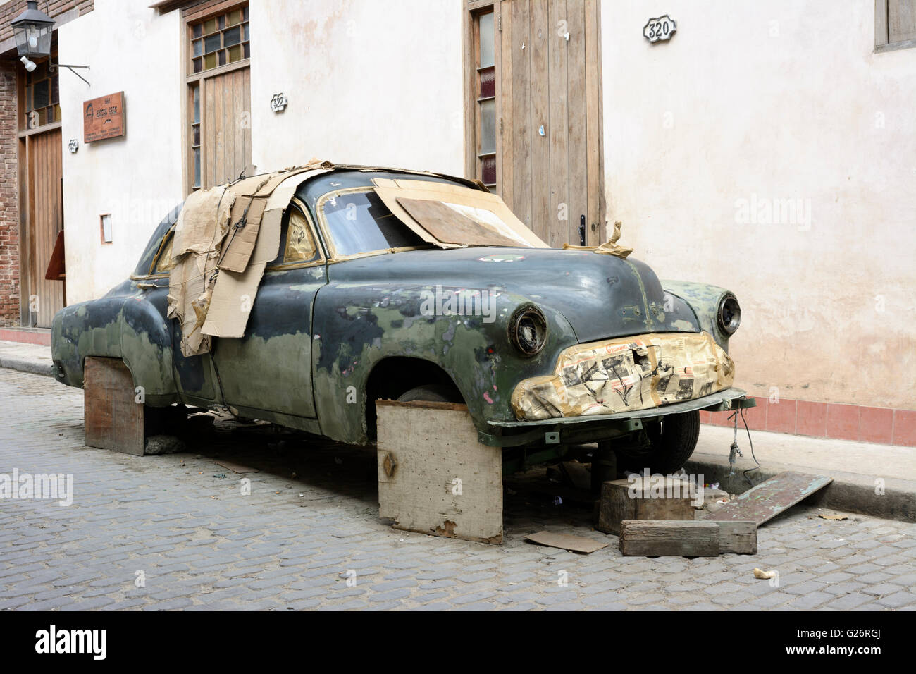 A vintage American car undergoing restoration in Havana, Cuba Stock ...