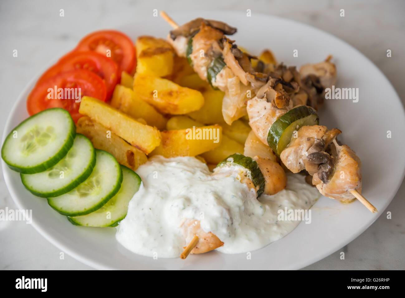 Traditional delicious chicken shish kebab with mushrooms. Served with ... Traditional delicious chicken shish kebab with mushrooms. Served with ...