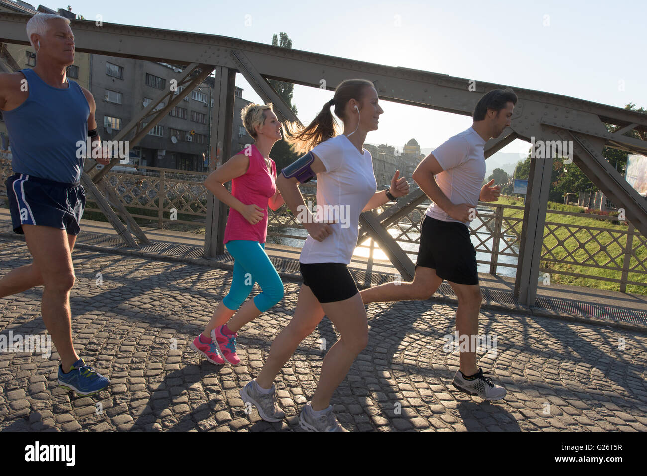 people group jogging runners team on morning training workout with ...