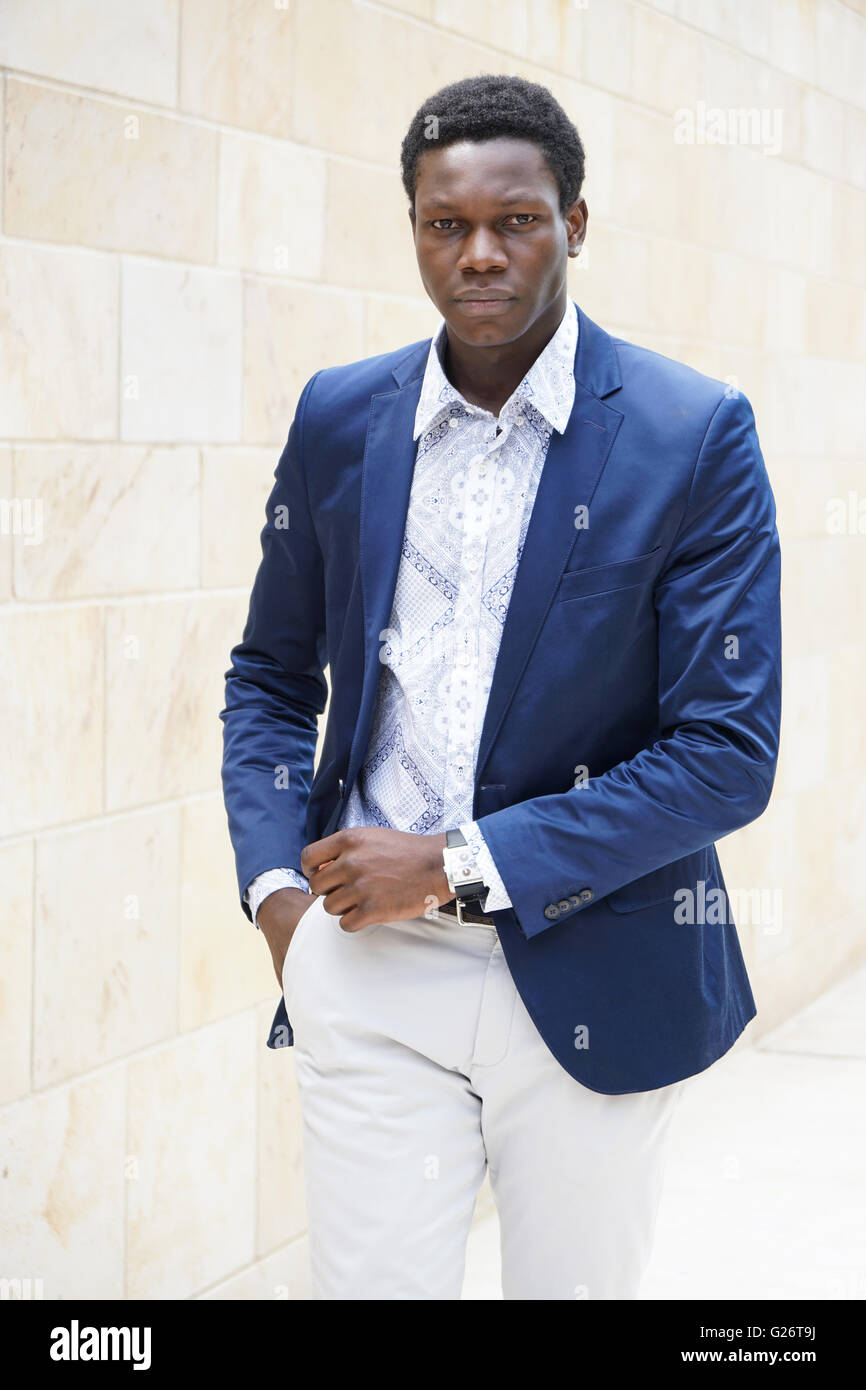 Young black african man walking hi-res stock photography and images - Alamy