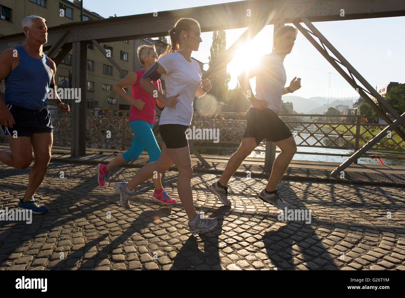people group jogging runners team on morning training workout with ...