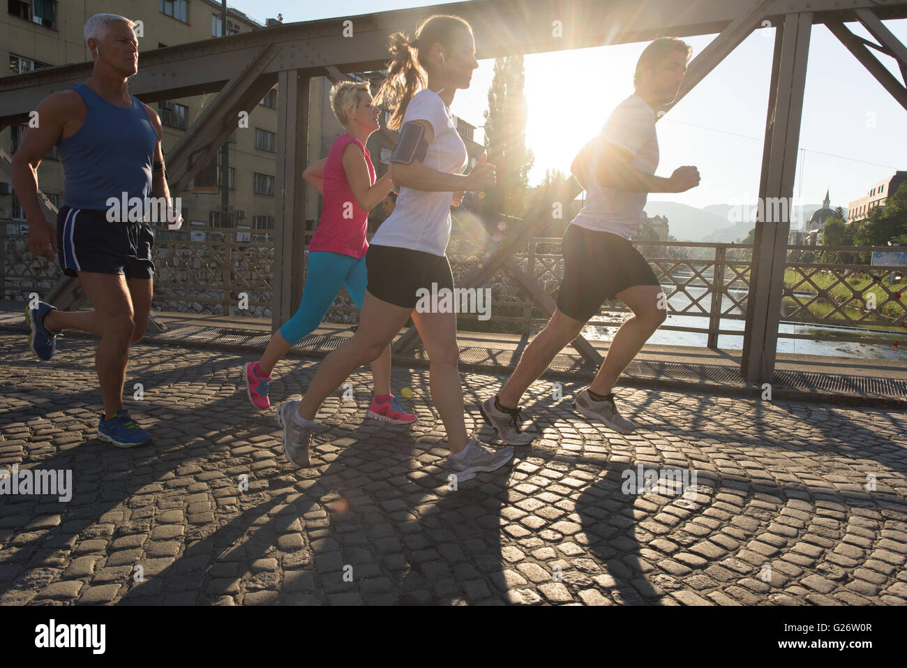 people group jogging runners team on morning training workout with ...