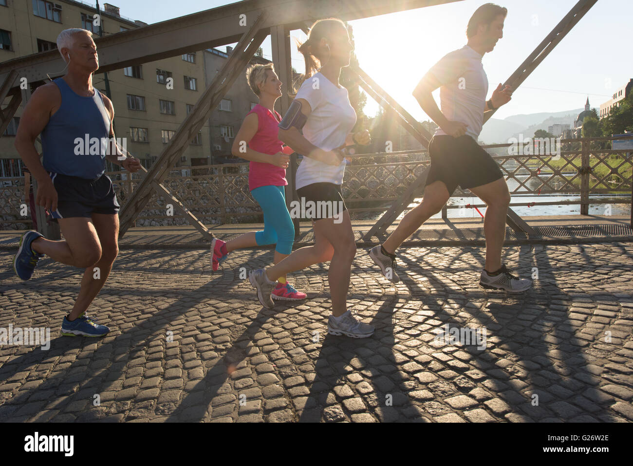 people group jogging runners team on morning training workout with ...