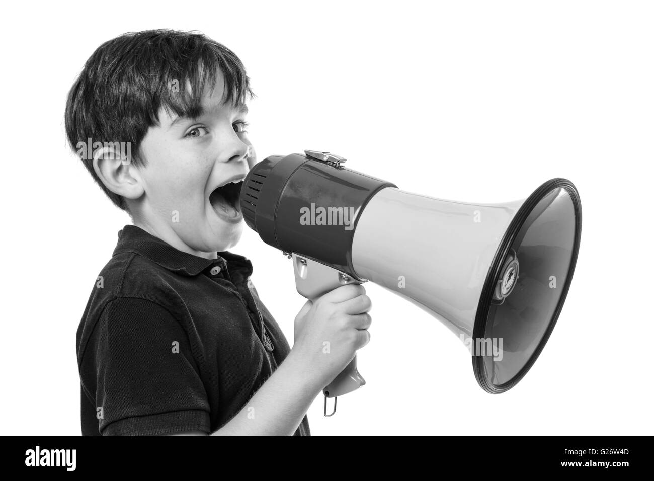 Studio shot of a young boy shouting into a megaphone Stock Photo - Alamy