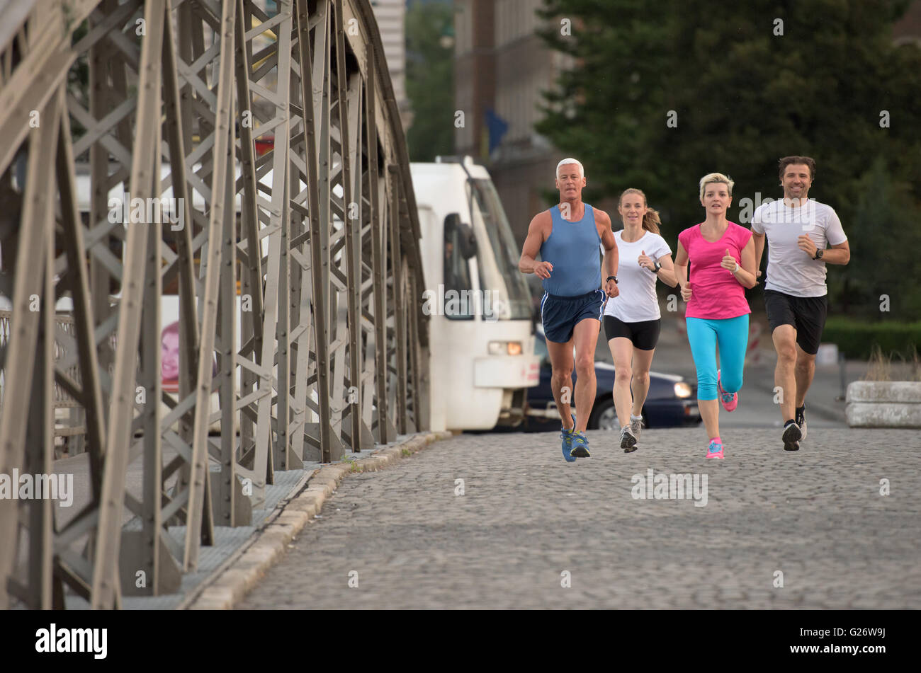 people group jogging runners team on morning training workout with ...