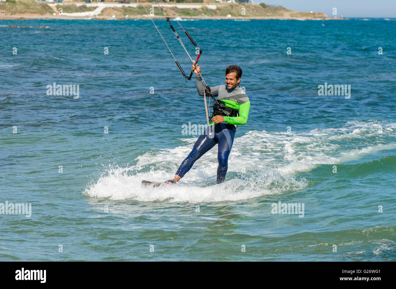 Kitesurfer is riding the waves hi-res stock photography and images - Alamy