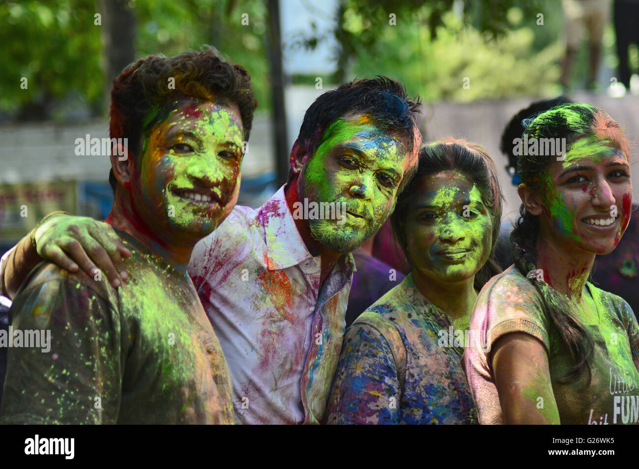 Colorful faces of boys and girls playing Holi (Festival of Colours ...