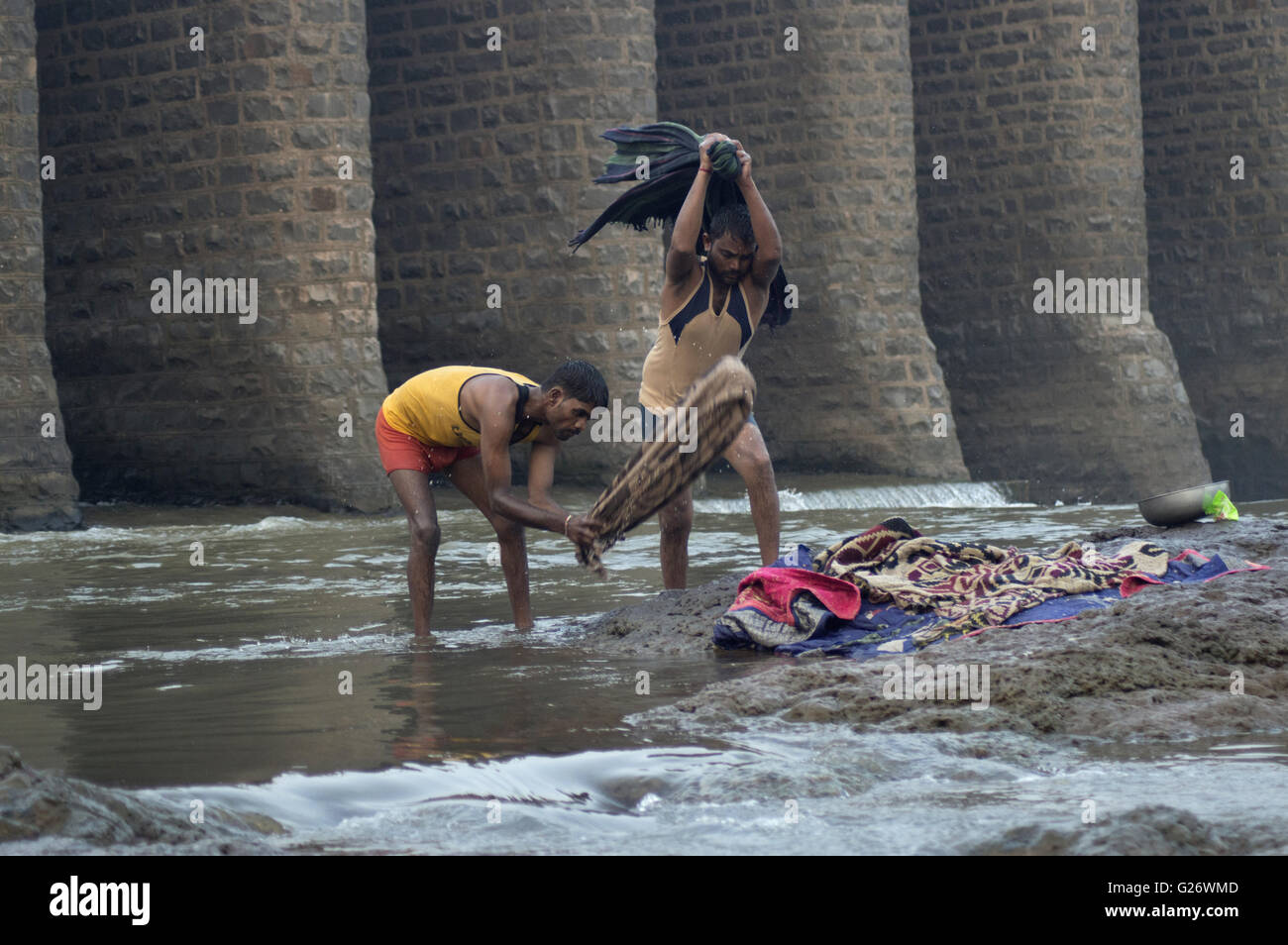 Men washing clothes hi-res stock photography and images - Alamy