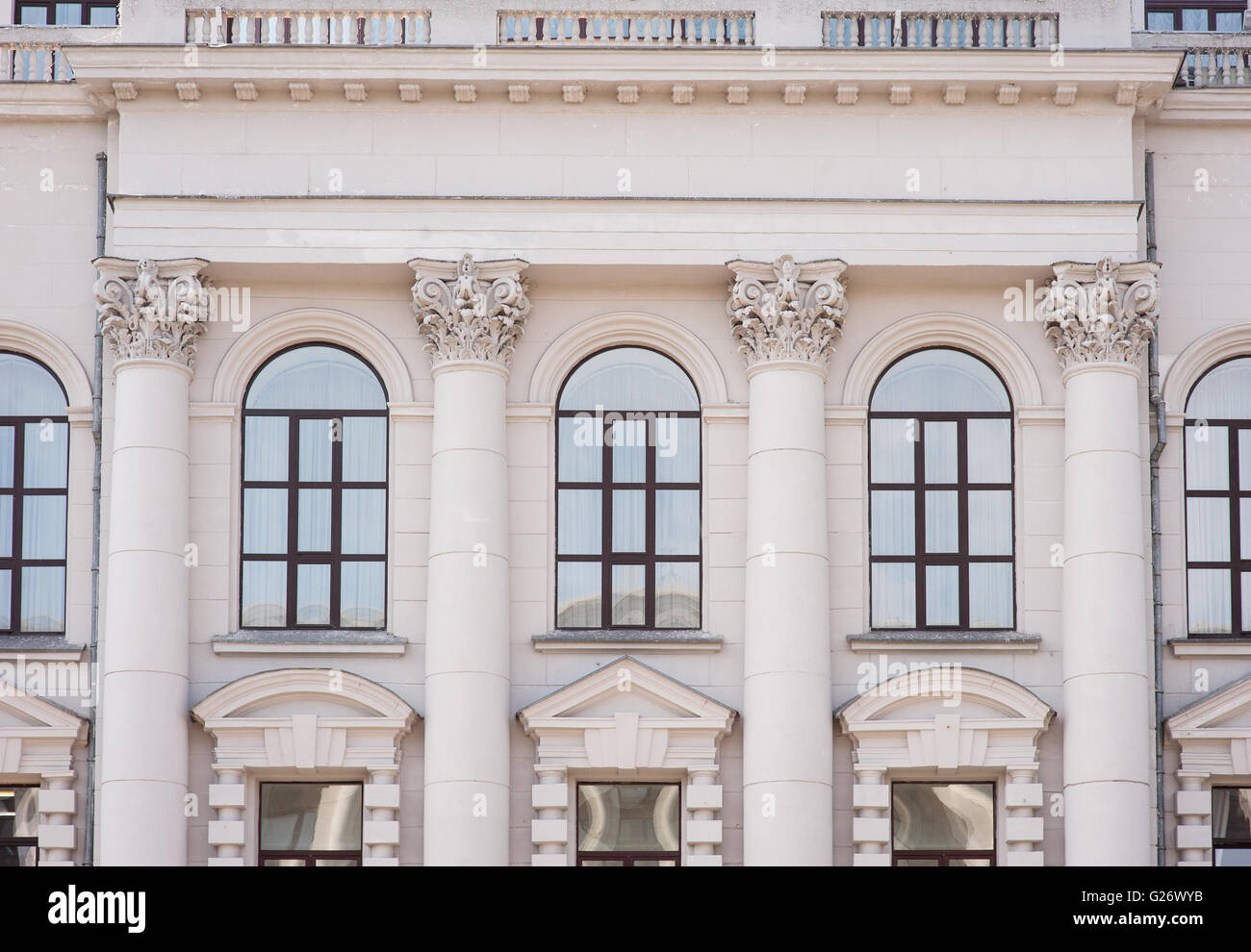 facade of an old building with columns and windows Stock Photo - Alamy