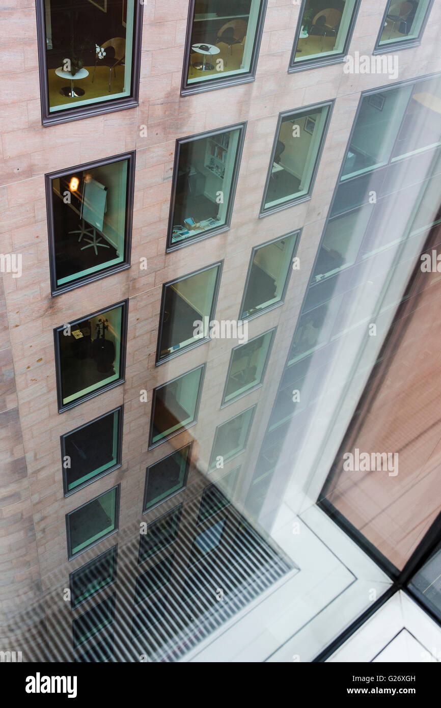 looking out of a London office block window with reflections on the ...