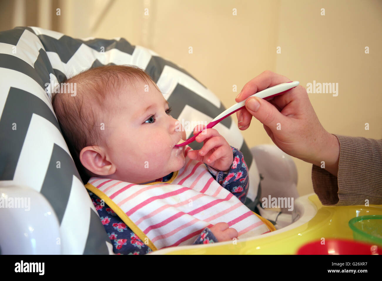 Baby being fed food hi-res stock photography and images - Alamy