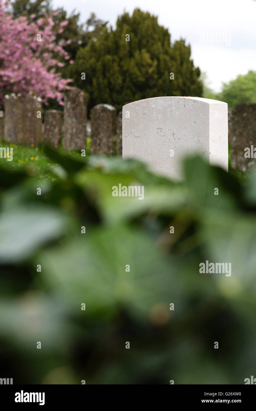 new clean plain head stone in a church graveyard Stock Photo - Alamy