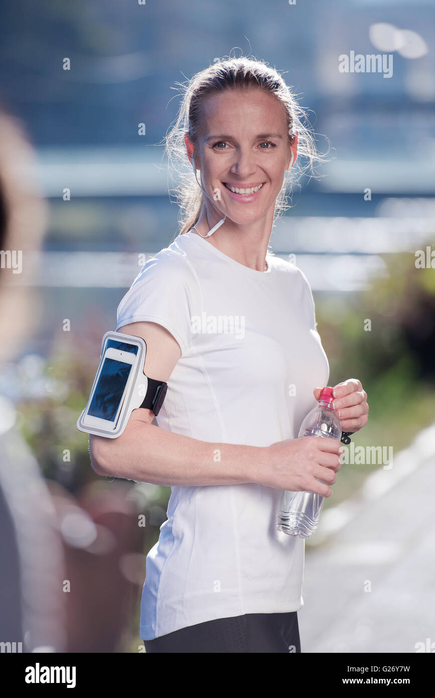 portrait of jogging woman before running on early morning with sunrise ...