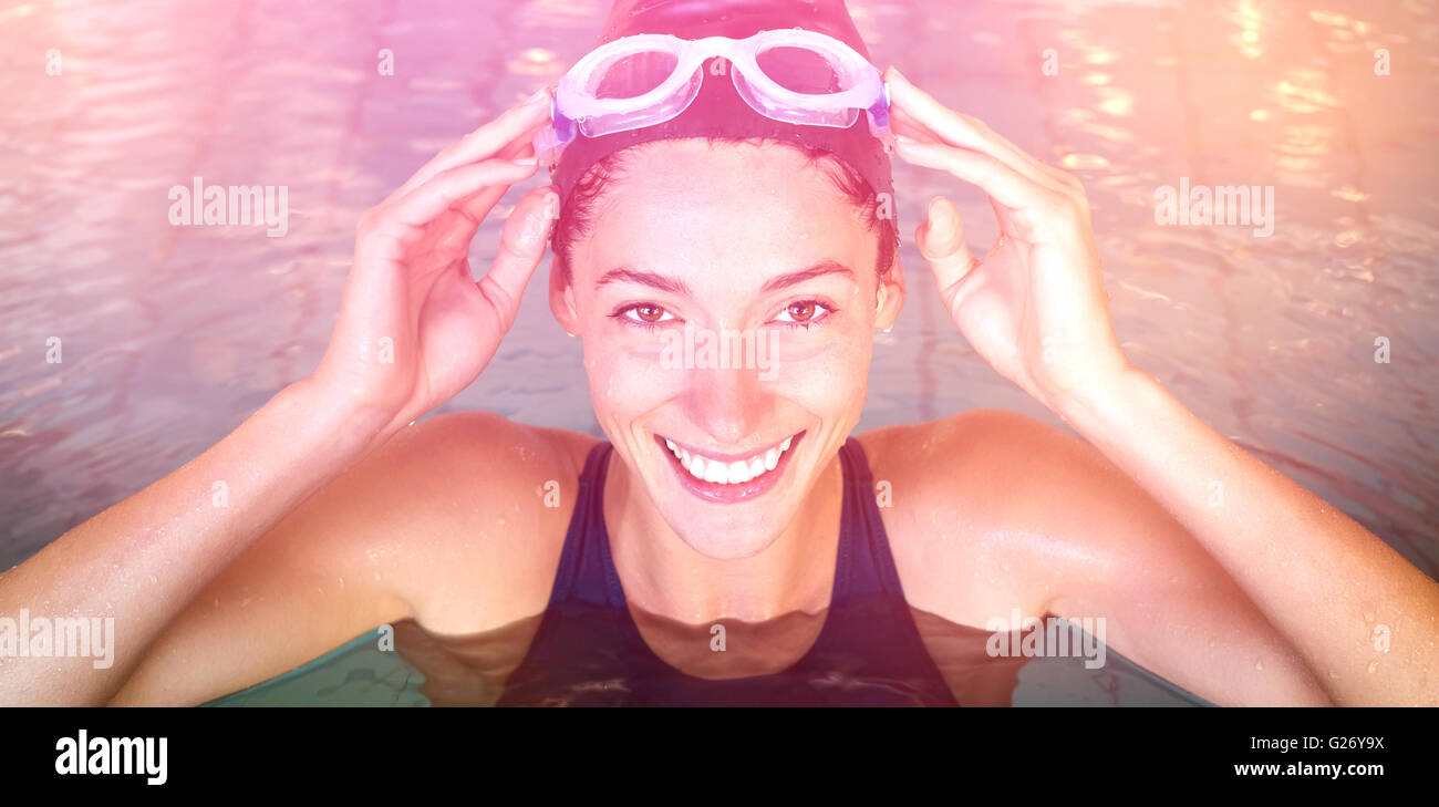 Fit swimmer smiling up at camera in the swimming pool Stock Photo - Alamy