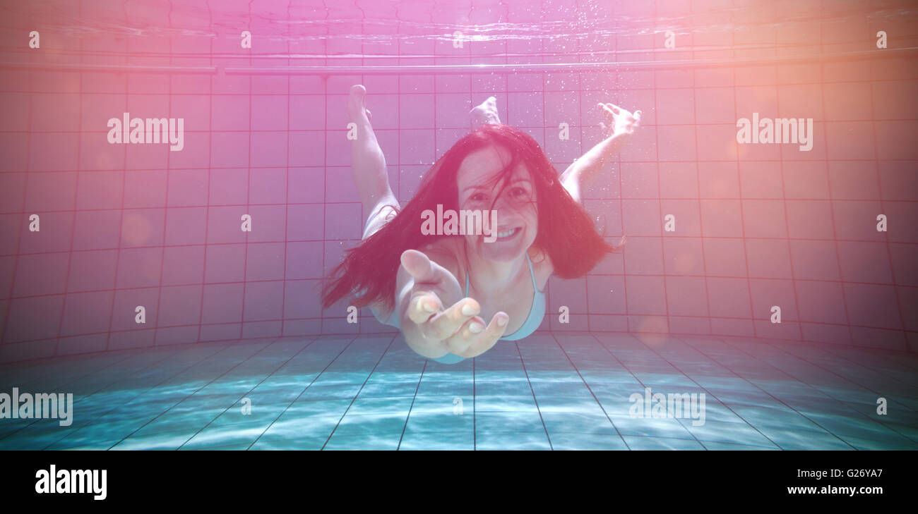 Pretty brunette smiling and offering her hand underwater Stock Photo ...