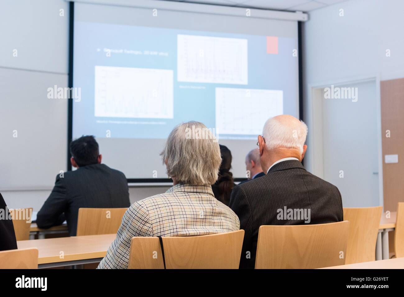 Audience at thesis presentation in a classroom Stock Photo - Alamy