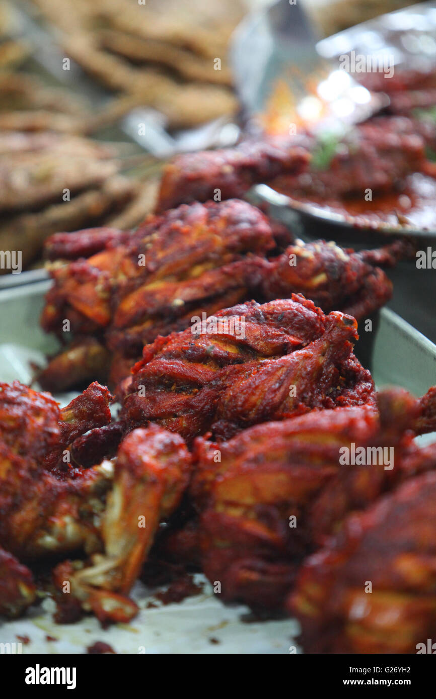 Delicious and spicy Indian delicacy tandoori chicken served in a plate ...