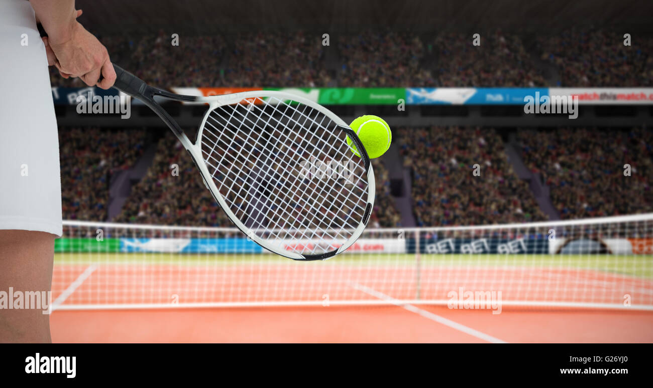 Composite image of athlete playing tennis with a racket Stock Photo - Alamy