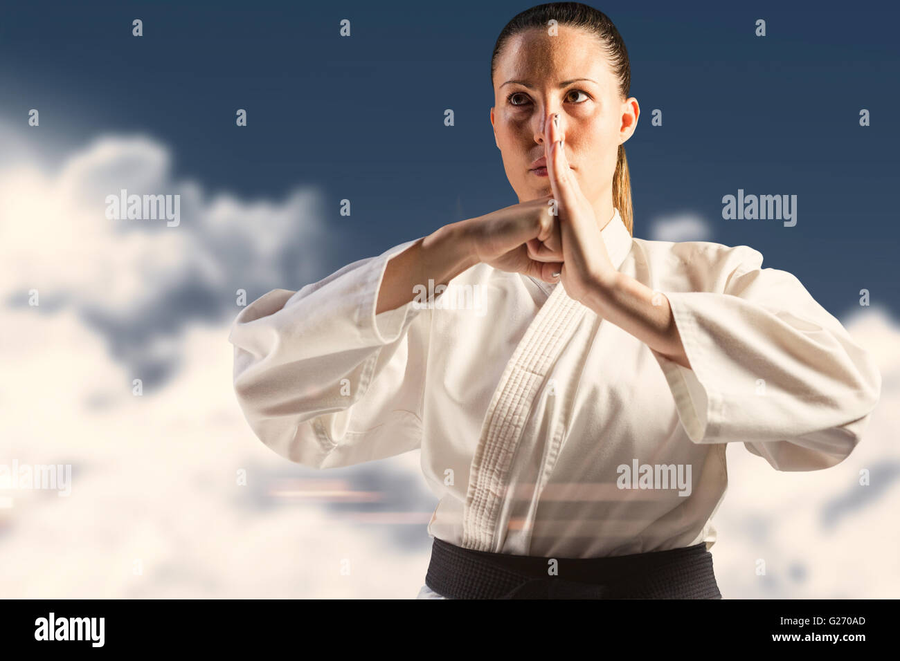 Composite image of female fighter performing hand salute Stock Photo ...
