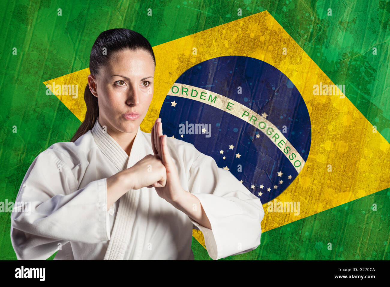 Composite image of female fighter performing hand salute Stock Photo ...