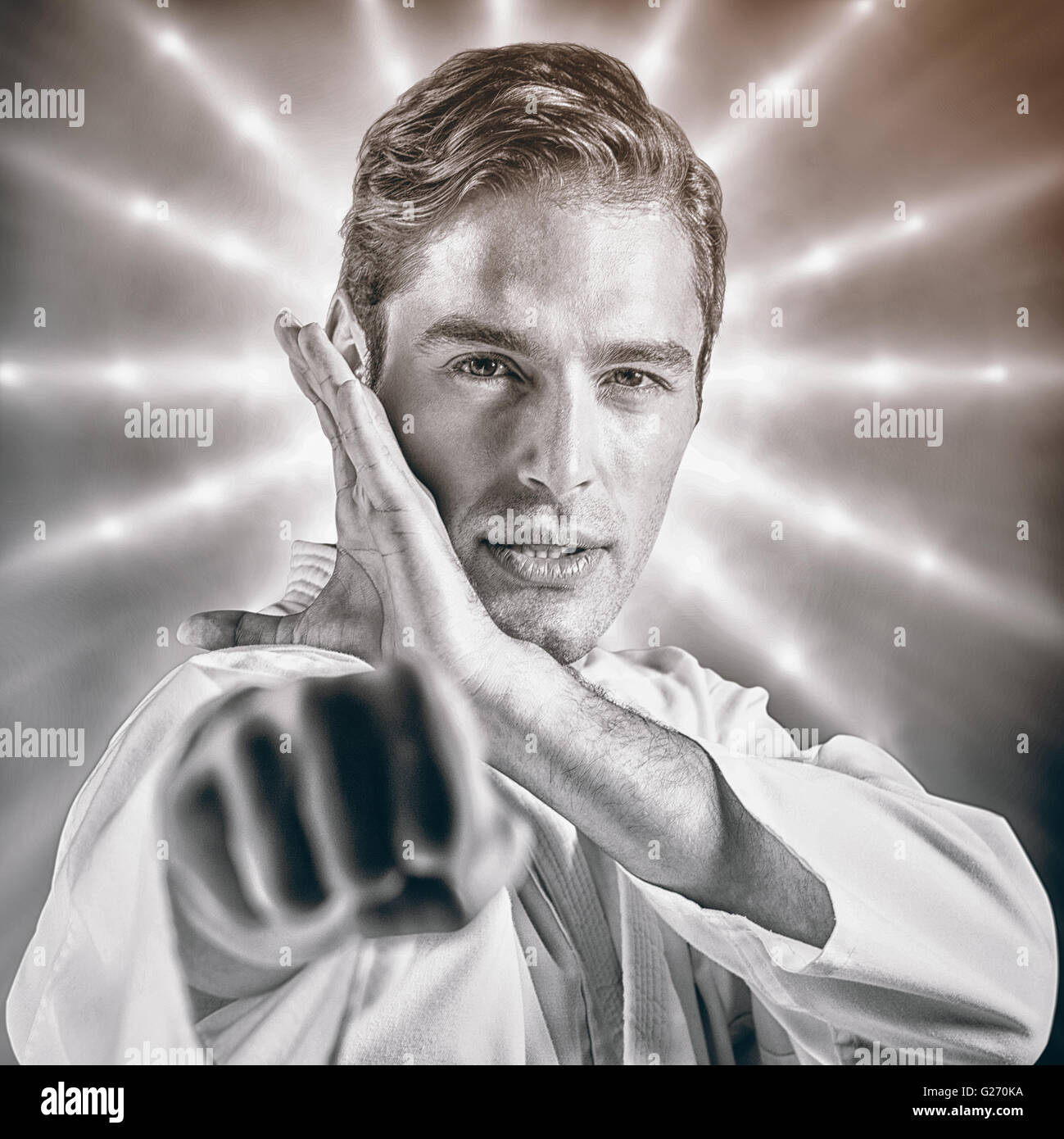 Composite image of portrait of fighter performing karate stance Stock ...