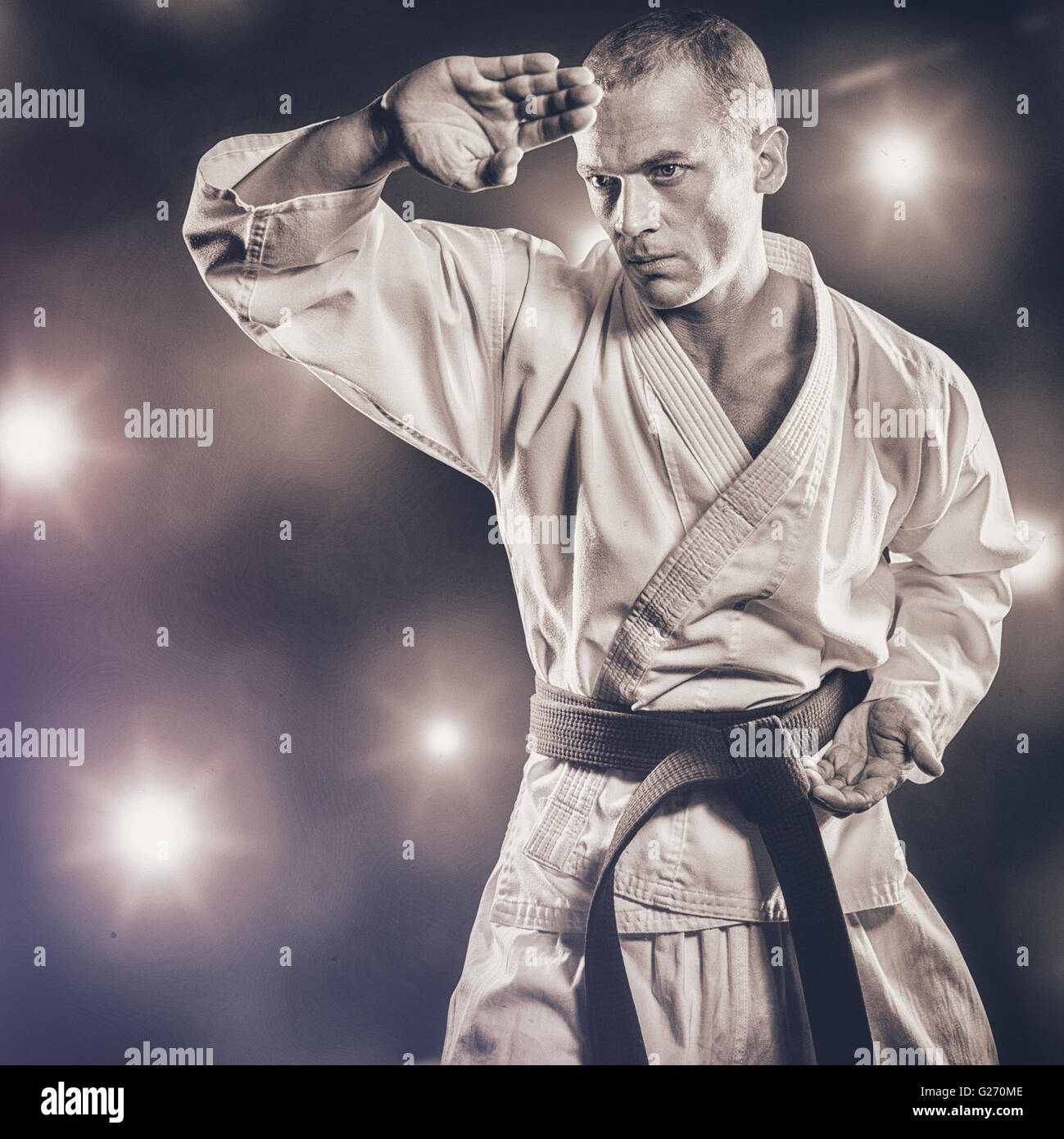 Composite image of fighter performing karate stance Stock Photo - Alamy