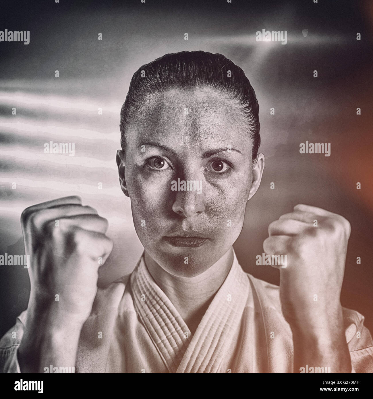 Composite image of female fighter performing karate stance Stock Photo ...