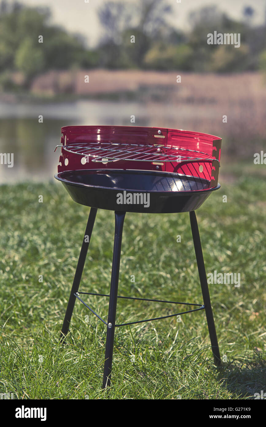 New grill ready to use in garden Stock Photo - Alamy