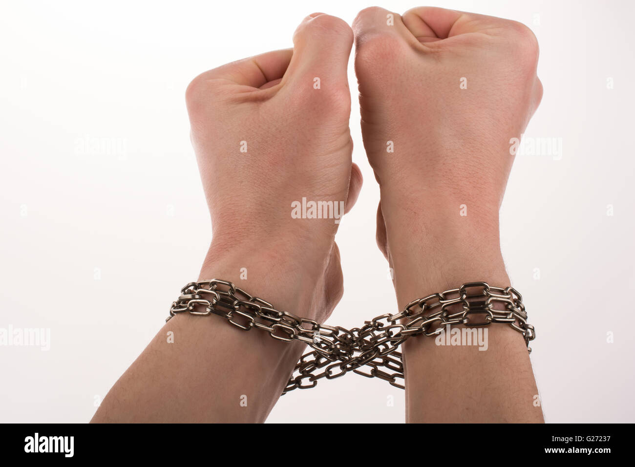 Hands in chains on a white background Stock Photo - Alamy