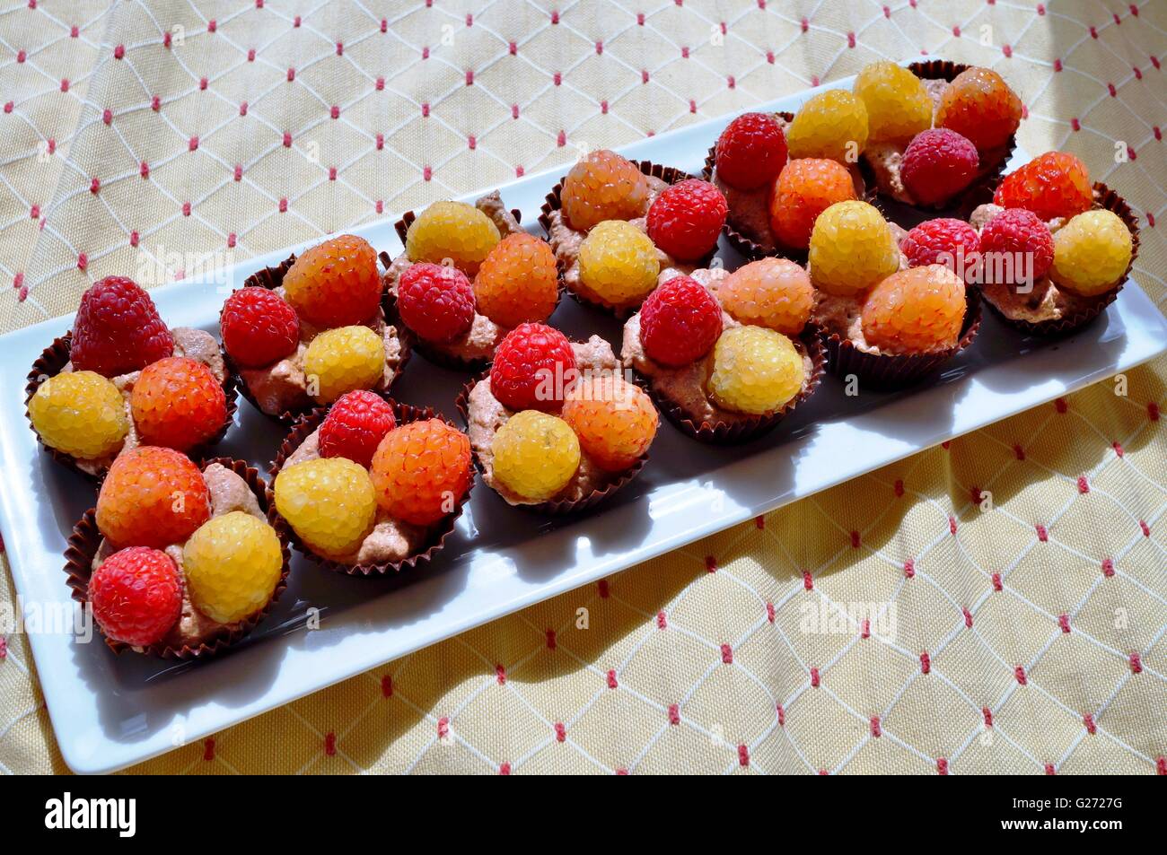 Chocolate tartlet shells filled with raspberries and aquafaba mousse ...