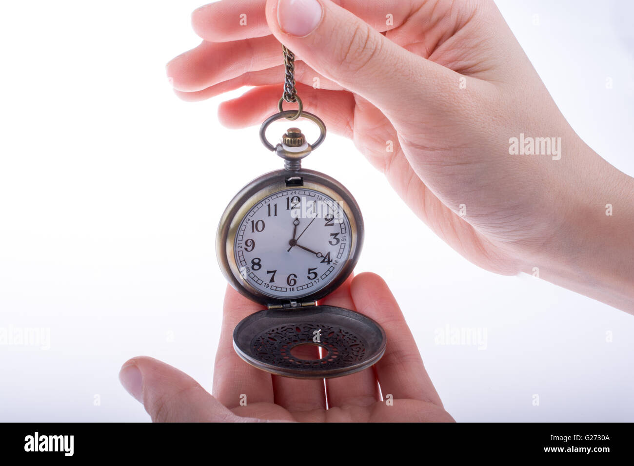 Hand holding a retro styled pocket watch in hand Stock Photo - Alamy