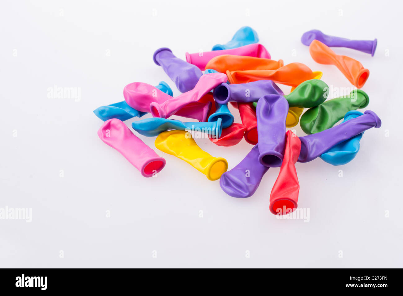 Heap Of Colorful Empty Balloons on a white backgorund Stock Photo - Alamy