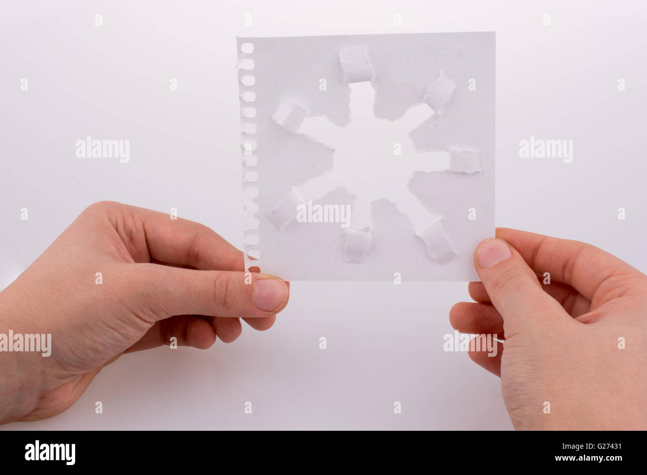 Hand holding paper art on a white background Stock Photo - Alamy
