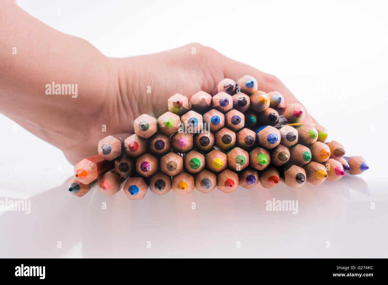 Hand holding Color pencils on a white background Stock Photo - Alamy