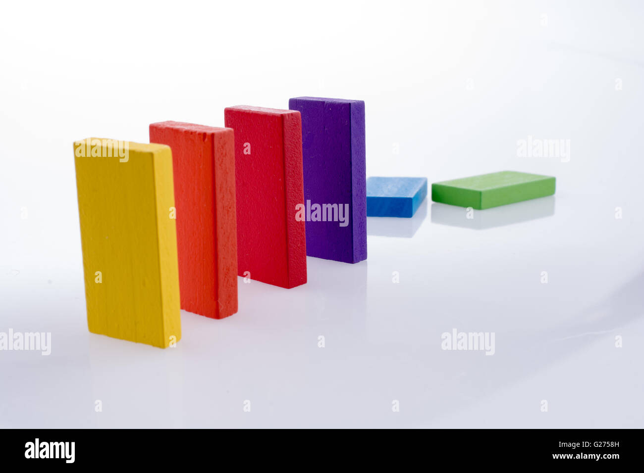 Color dominoes on a white background Stock Photo - Alamy