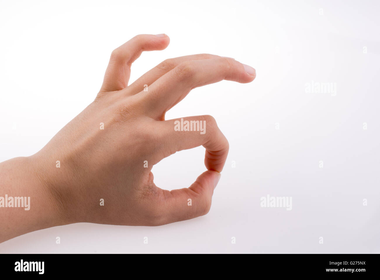 Hand making 'good' symbol on a whitebackground Stock Photo - Alamy