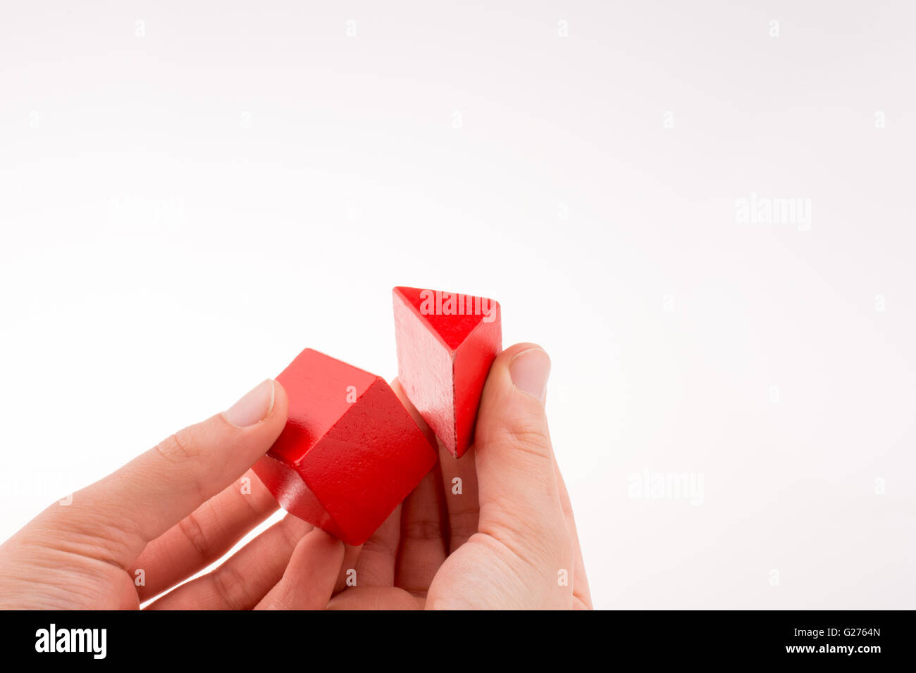 Hand making house with colorful cubes on a white background Stock Photo ...