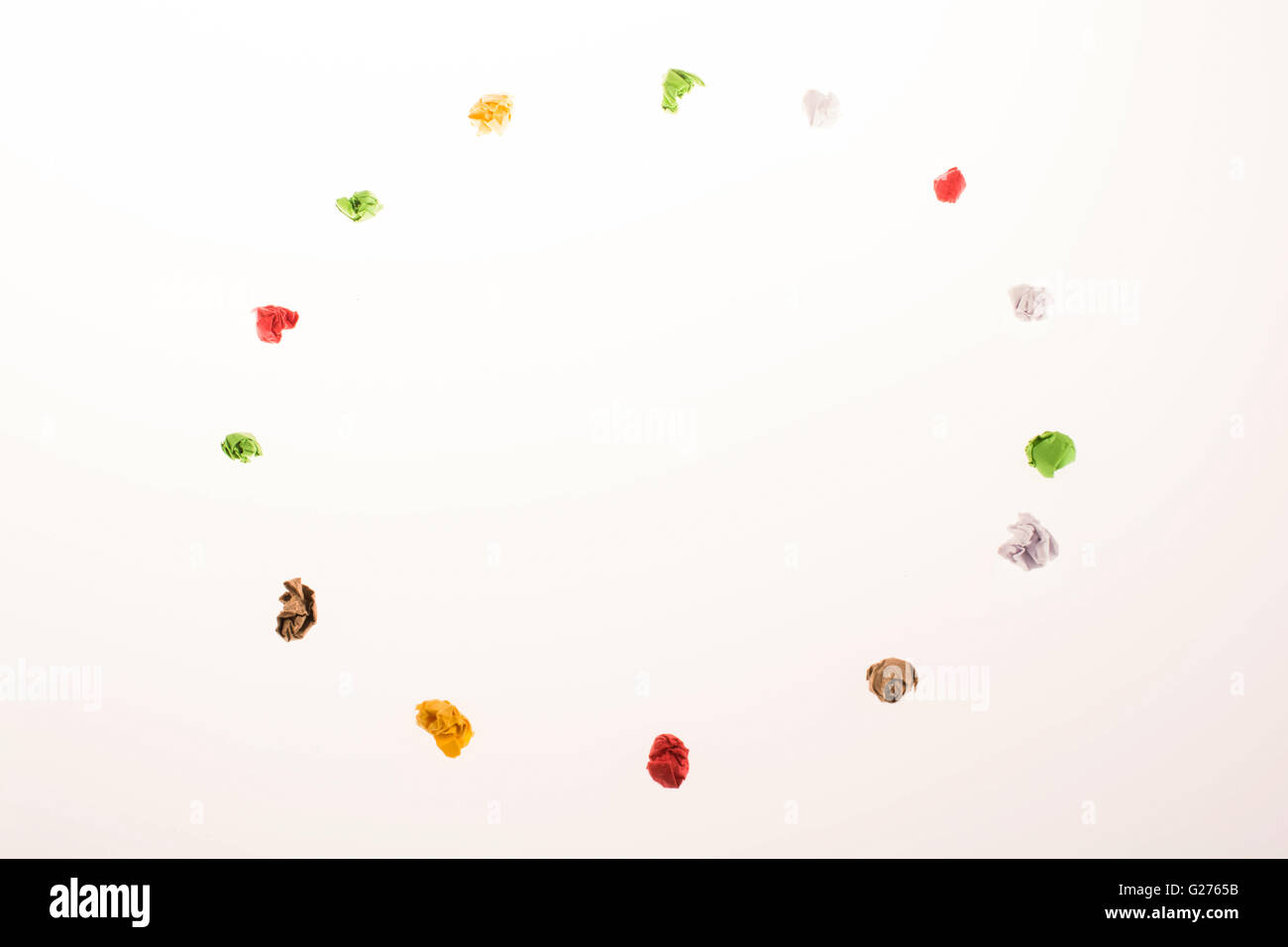 Colorful crumpled papers form a round shape on white background Stock ...