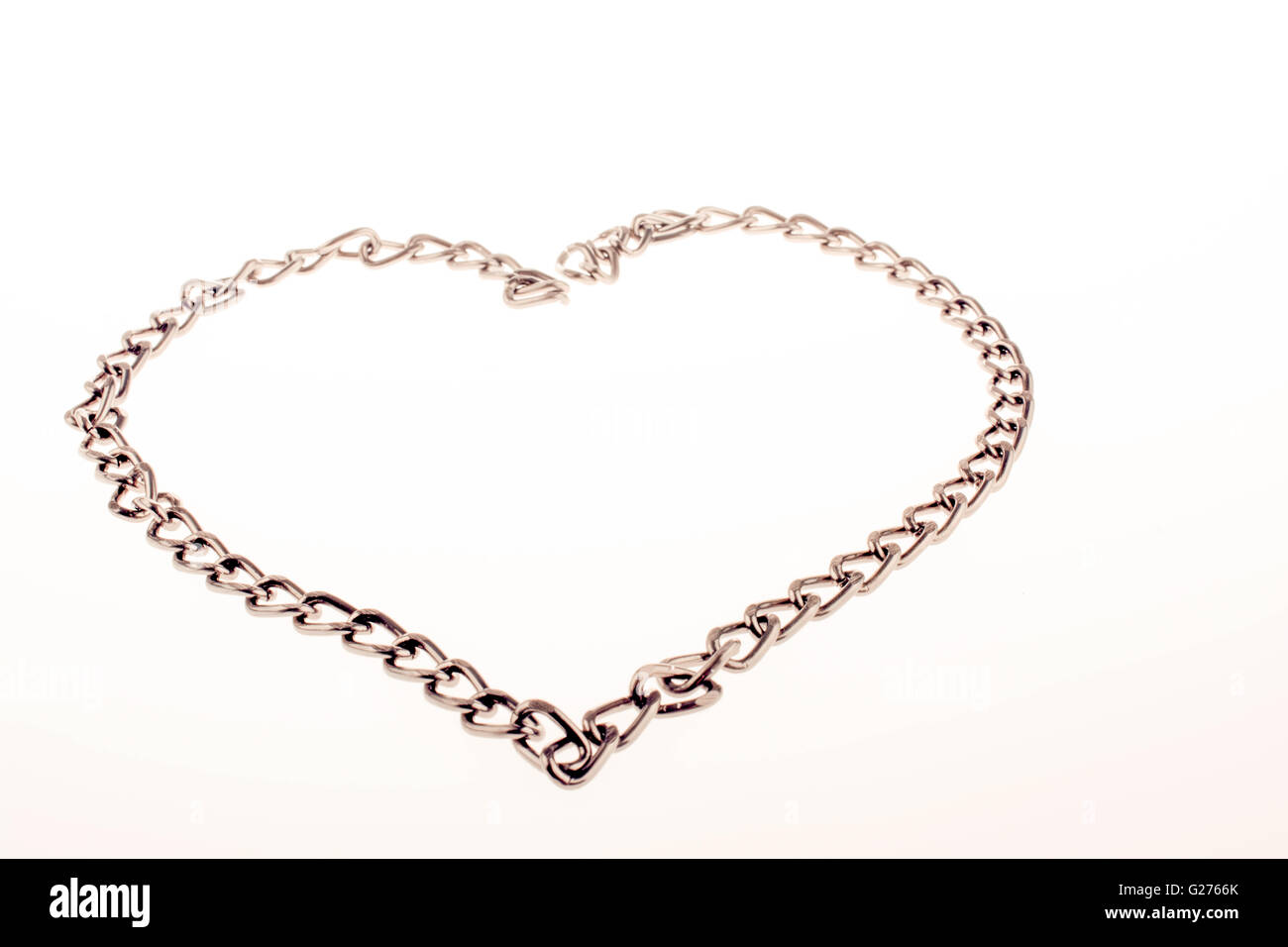 Chain forms a heart shape on a white background Stock Photo - Alamy