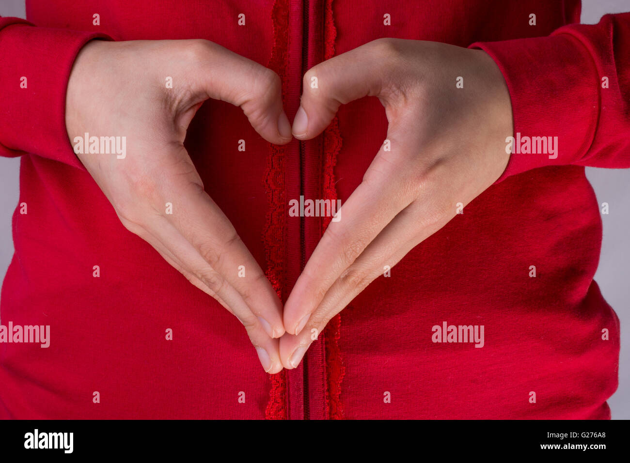 Hand making a heart on a white background Stock Photo - Alamy