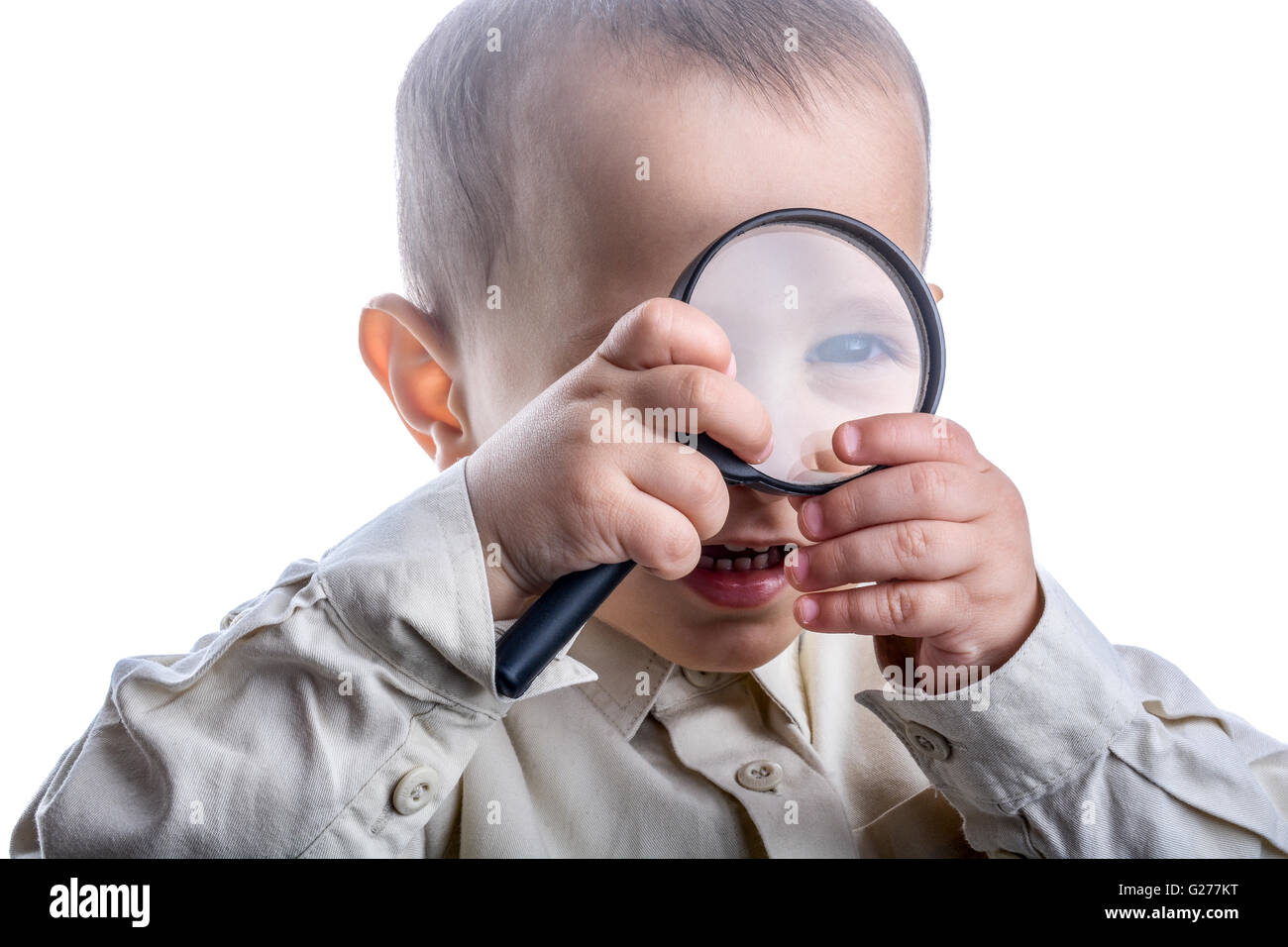 Baby holding a magnifying glass in hand on a white background Stock ...
