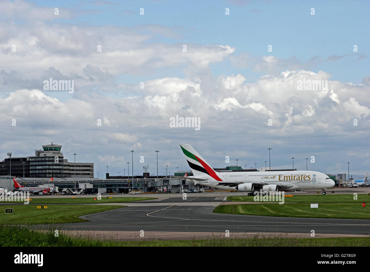 Emirates Airlines Airbus A380-861 airliner leaving terminal at ...