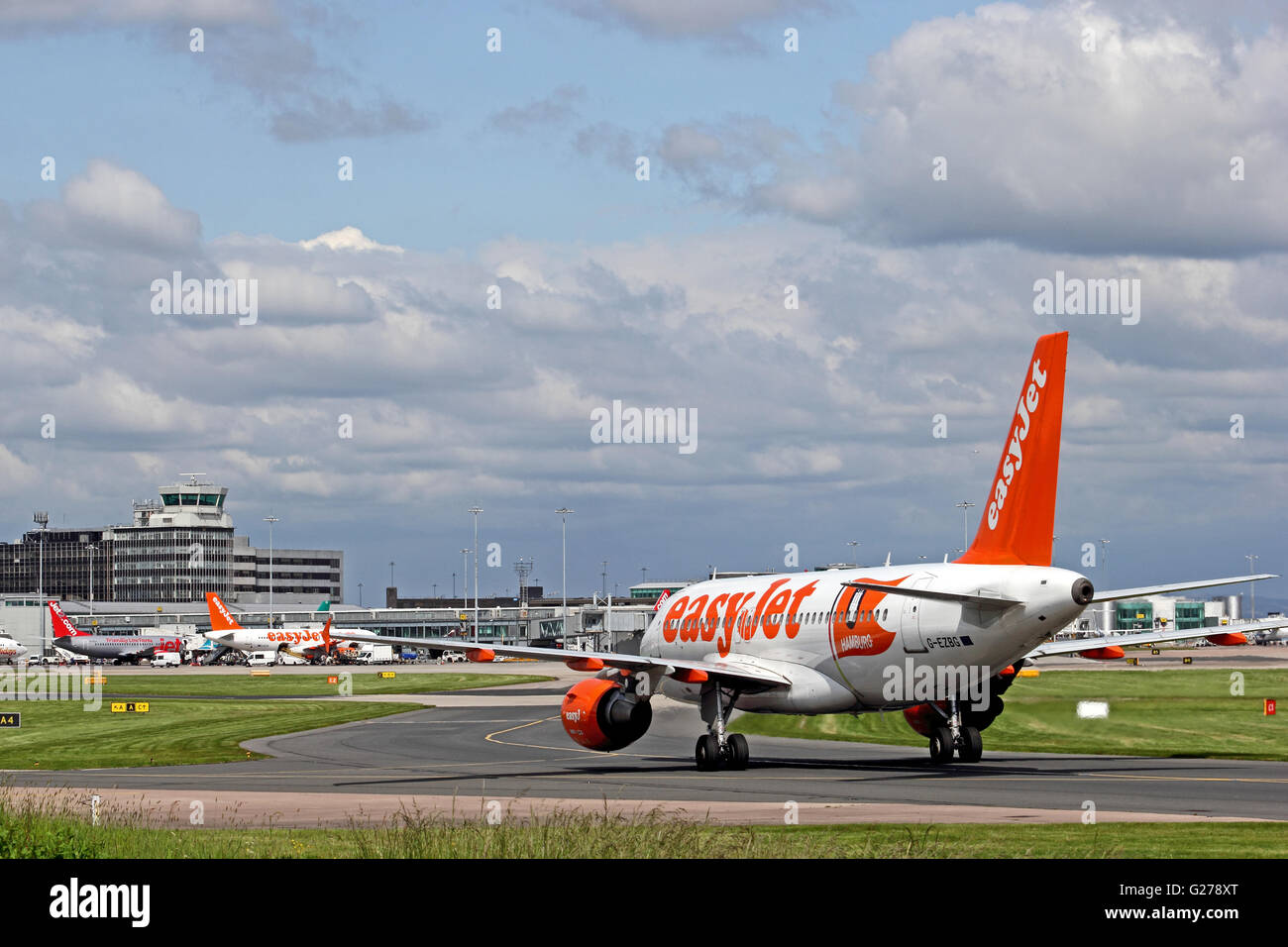 Easyjet Airbus A320-111 airliner taxiing into terminal at Manchester ...