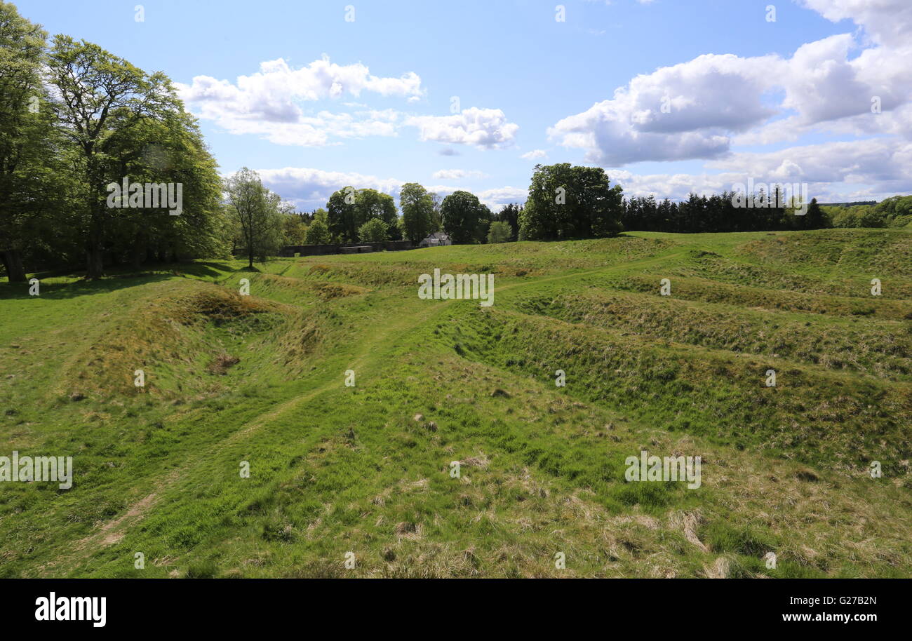 Remains of ditches and ramparts and access road to Ardoch Roman Fort ...